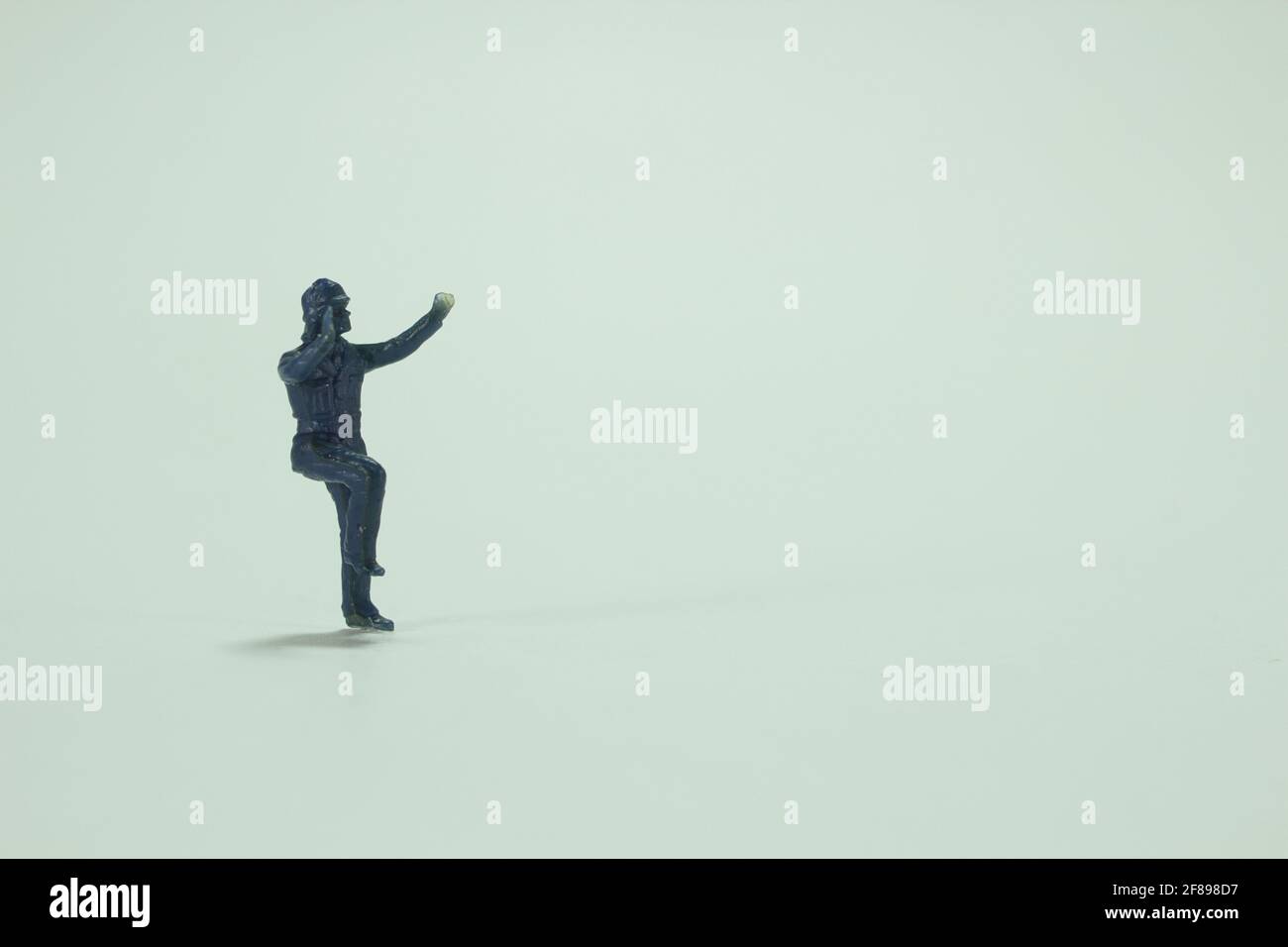 Minifigure of a person standing on one leg with raised arms /miniature ...