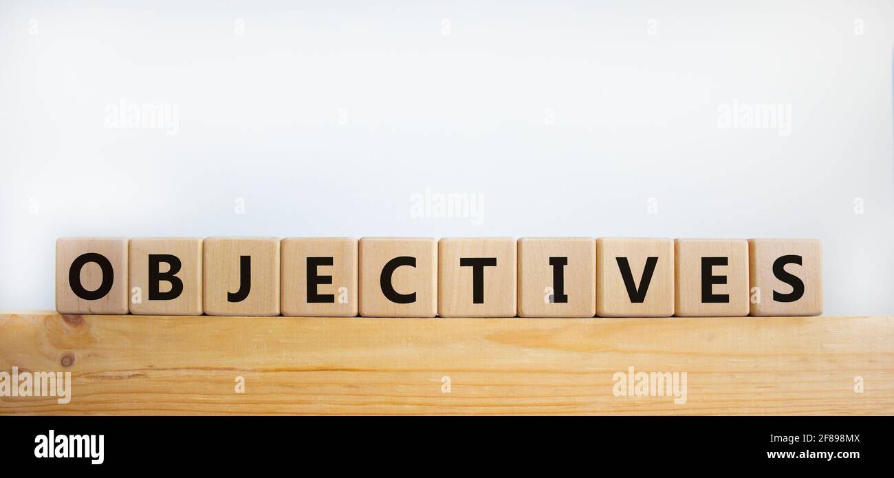 Objectives symbol. Word 'objectives' written on wooden blocks. Business ...
