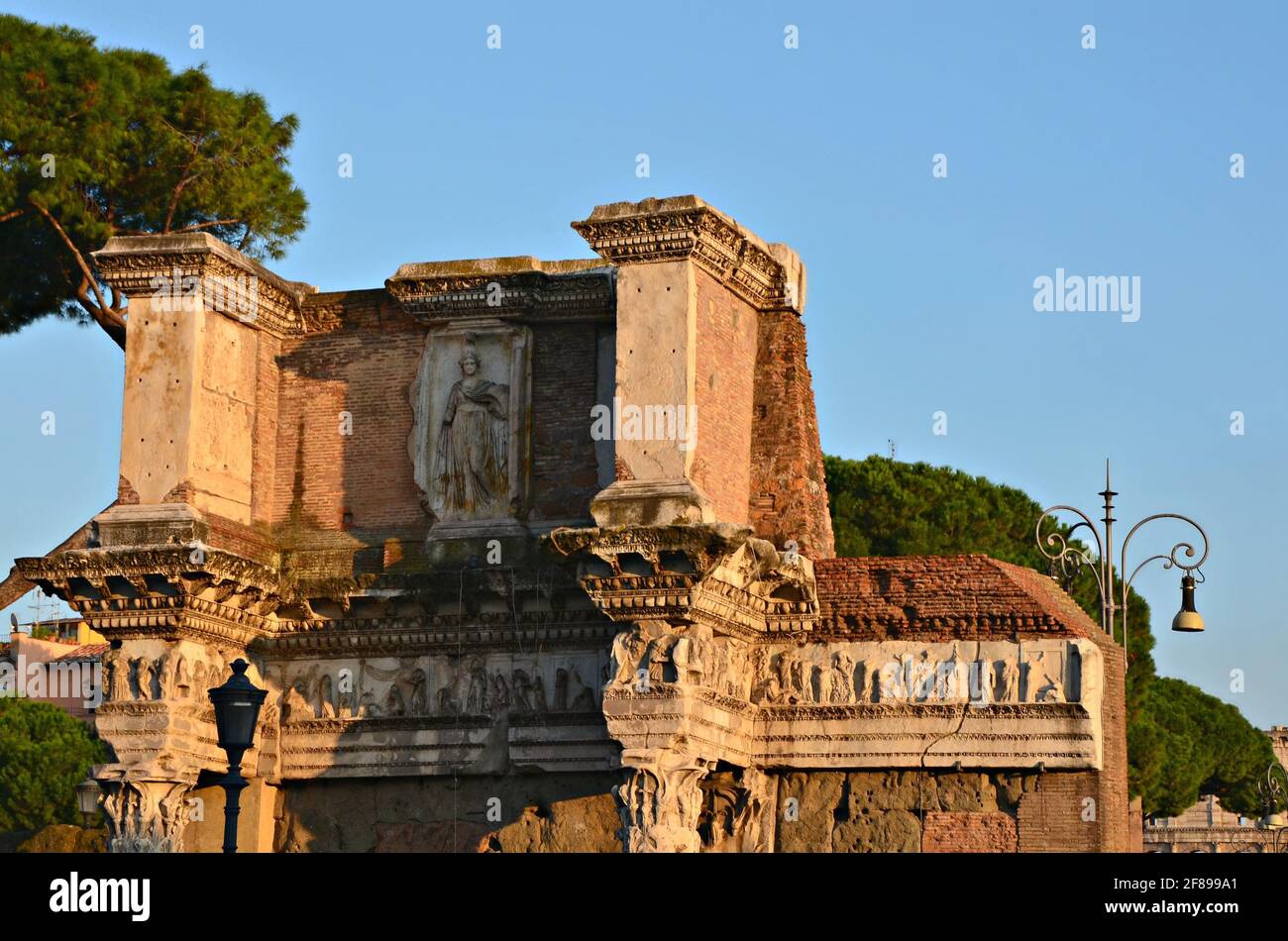 Ancient Roman ruins with historic figures in Rome, Italy Stock Photo ...