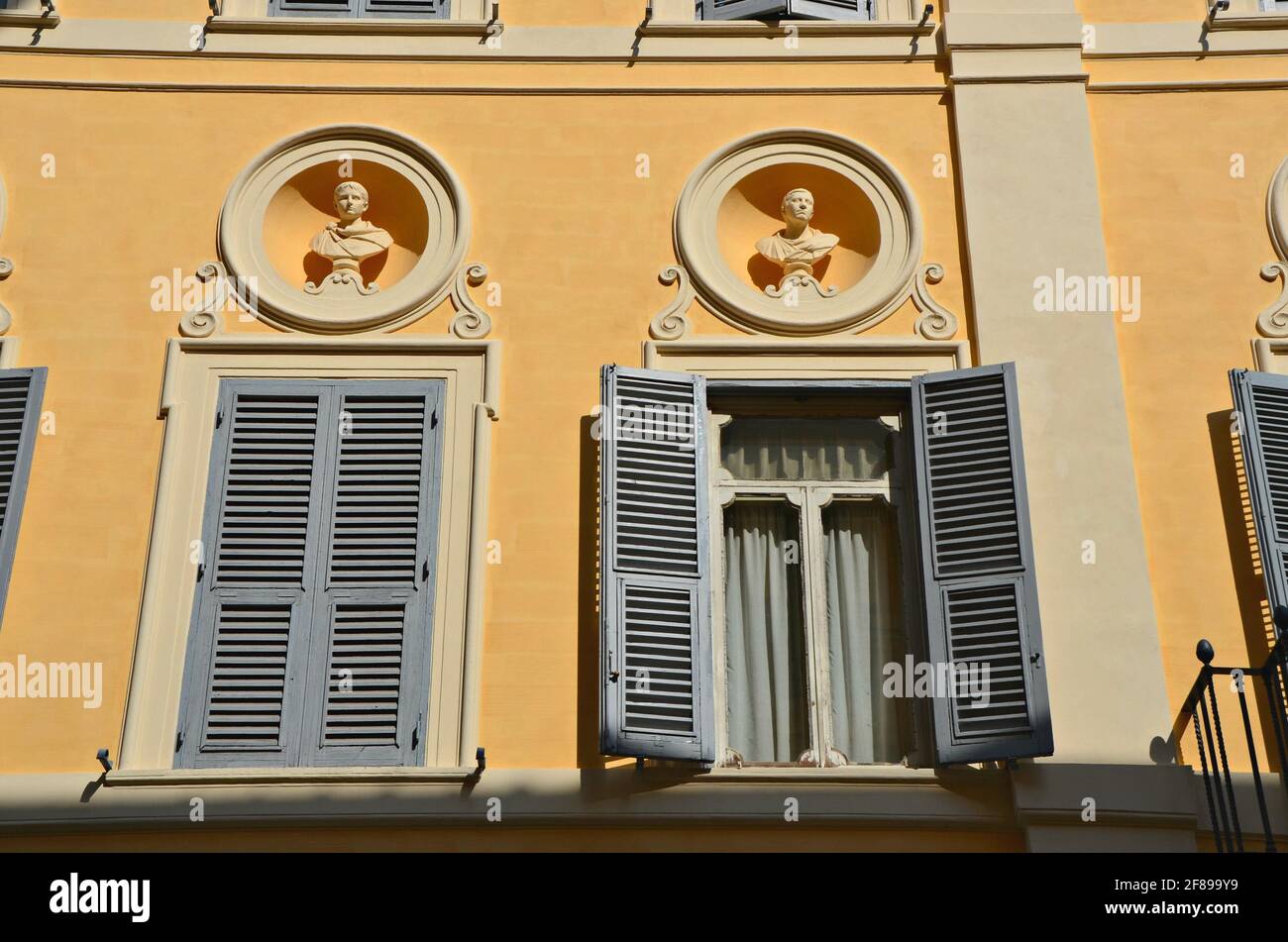 Neoclassical building facade with a Venetian stucco wall, white plaster ...