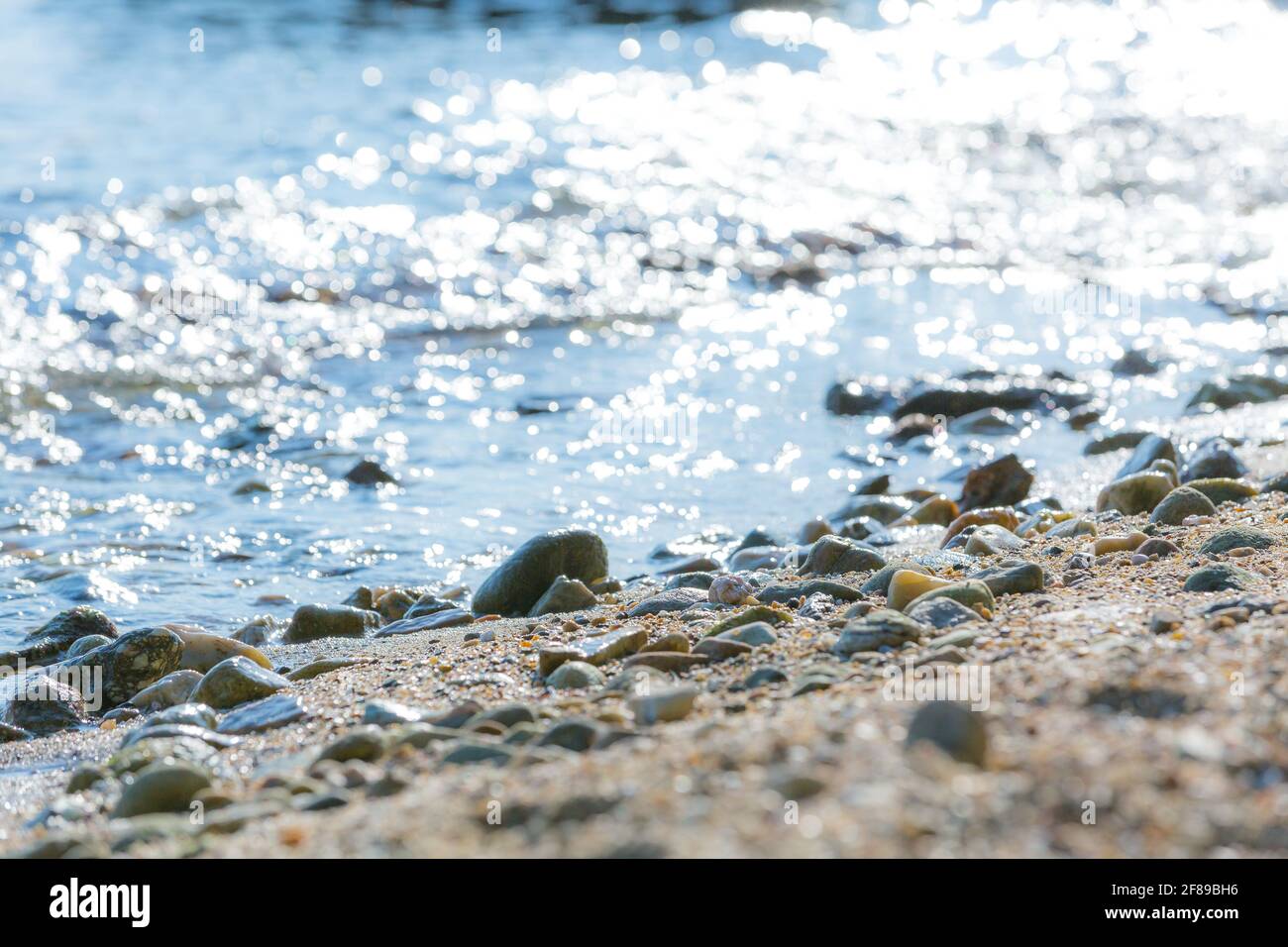 Sea stones background, ocean water edge at the beach coast Stock Photo ...