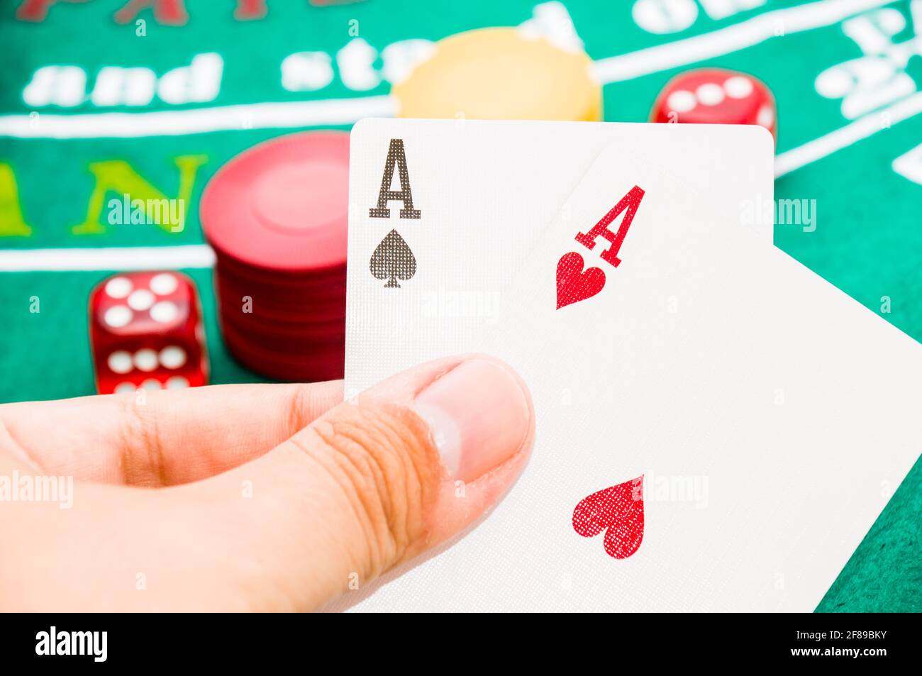 Human hand holding two cards hi-res stock photography and images - Alamy