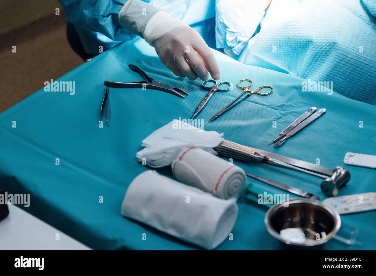 View of set of medical tools placed on table in spot of light near ...