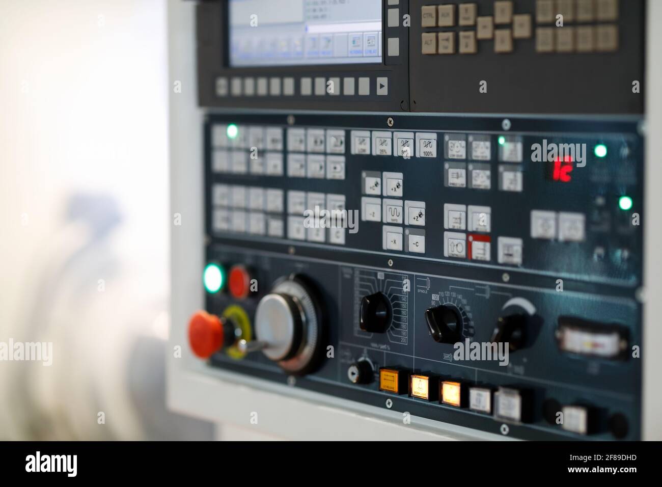 CNC controls of modern industrial machining center. Selective focus ...