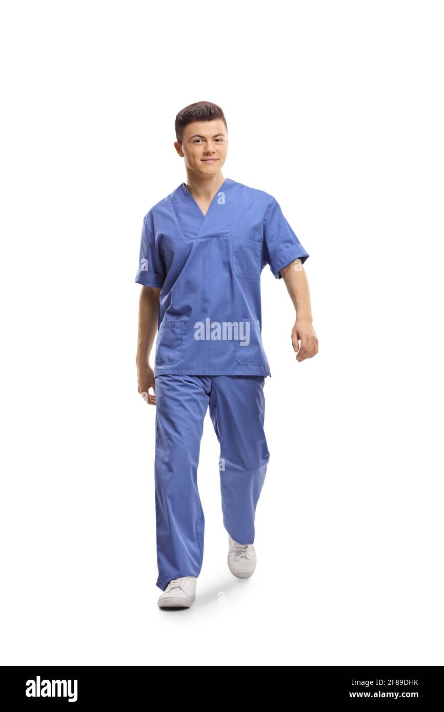Full length portrait of a male health worker in a blue uniform walking ...