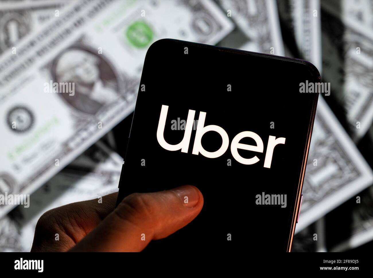 In this photo illustration, the American online ridesharing and ...