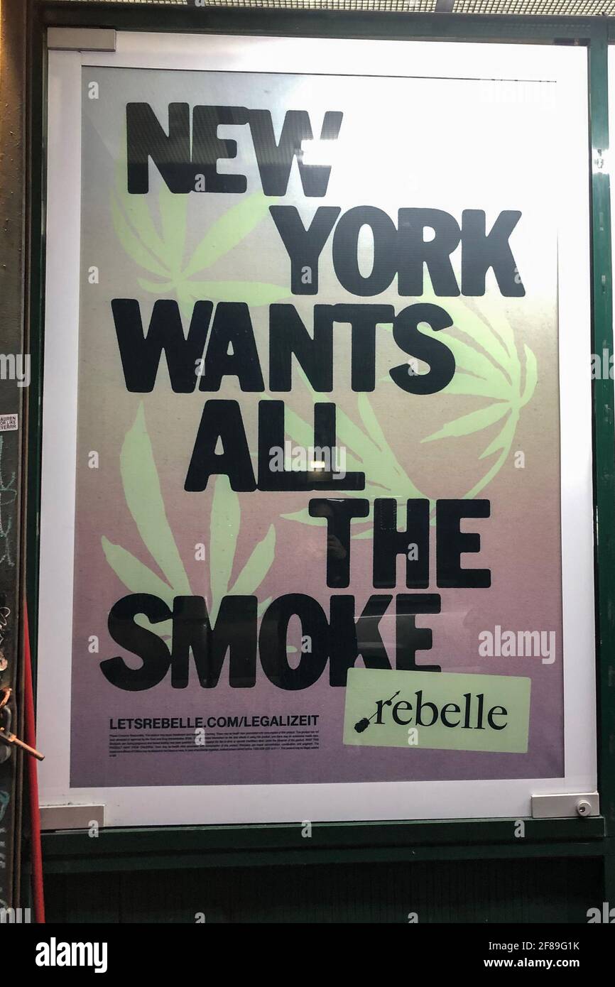 A poster advertising a petition for new cannabis laws hangs in the ...