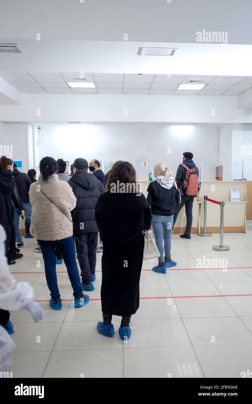 queue in front of reception at the clinic Stock Photo - Alamy