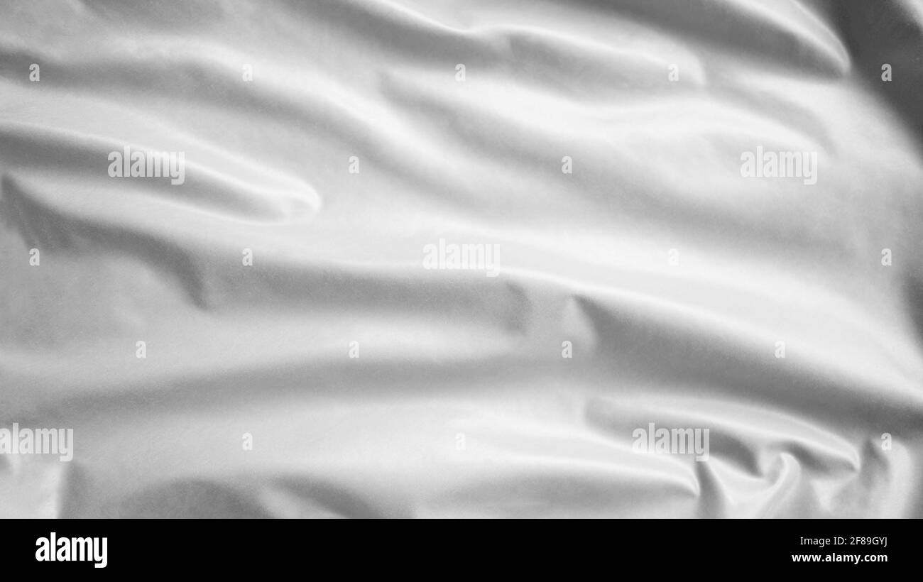 Empty white flag waving in the wind. Close up of symbol of surrender ...