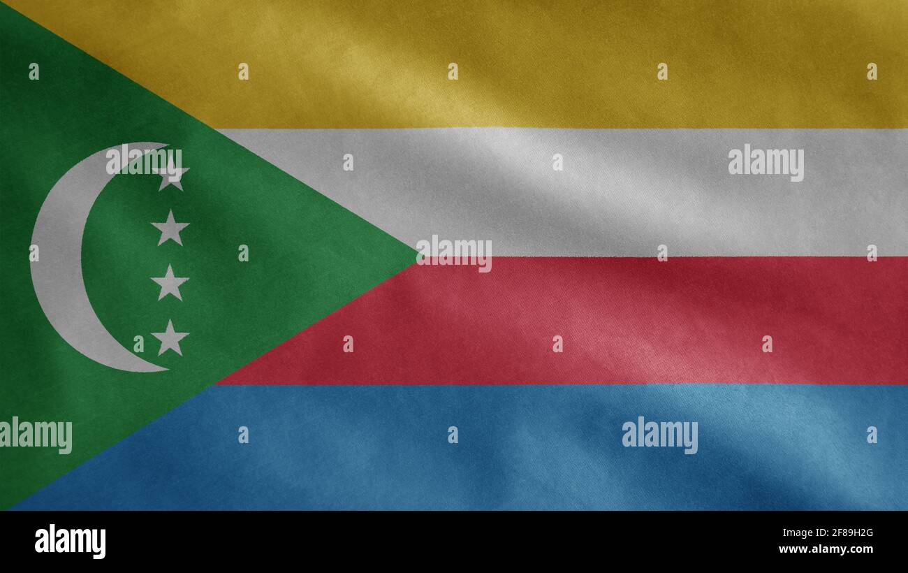 Comorian flag waving in the wind. Close up of Comoros banner blowing ...