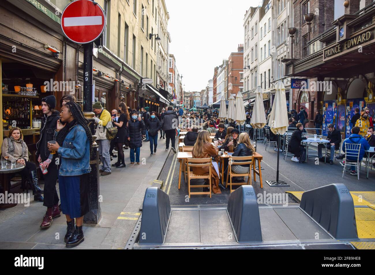 People seen sitting at busy bars and restaurants in Old Compton Street ...