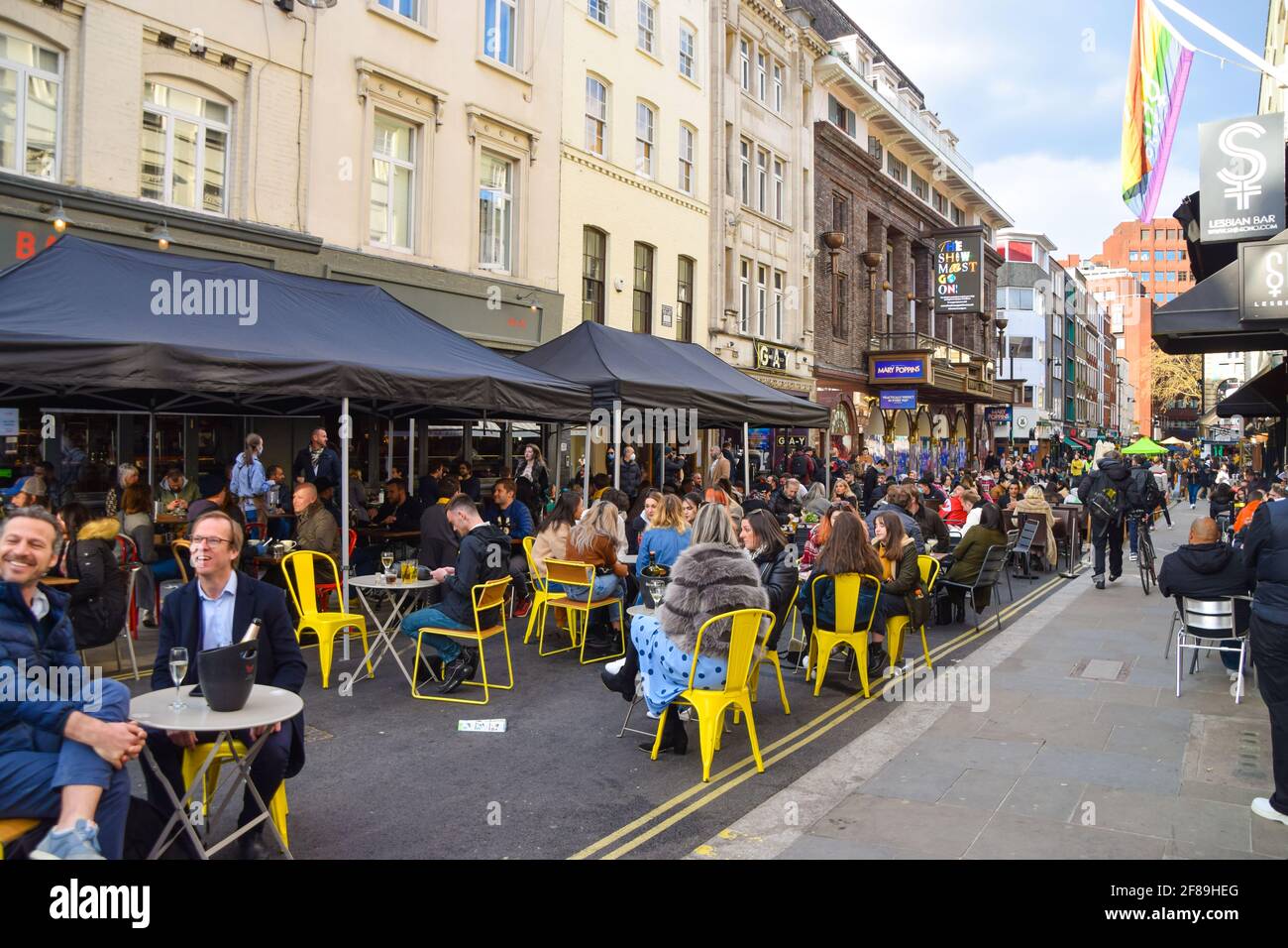 People seen sitting at busy bars and restaurants in Old Compton Street ...