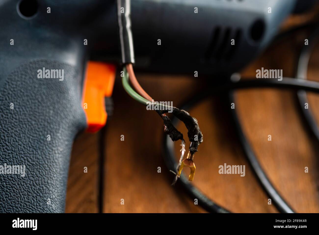 Burning wires on parts of an electrical appliance in a repair shop ...