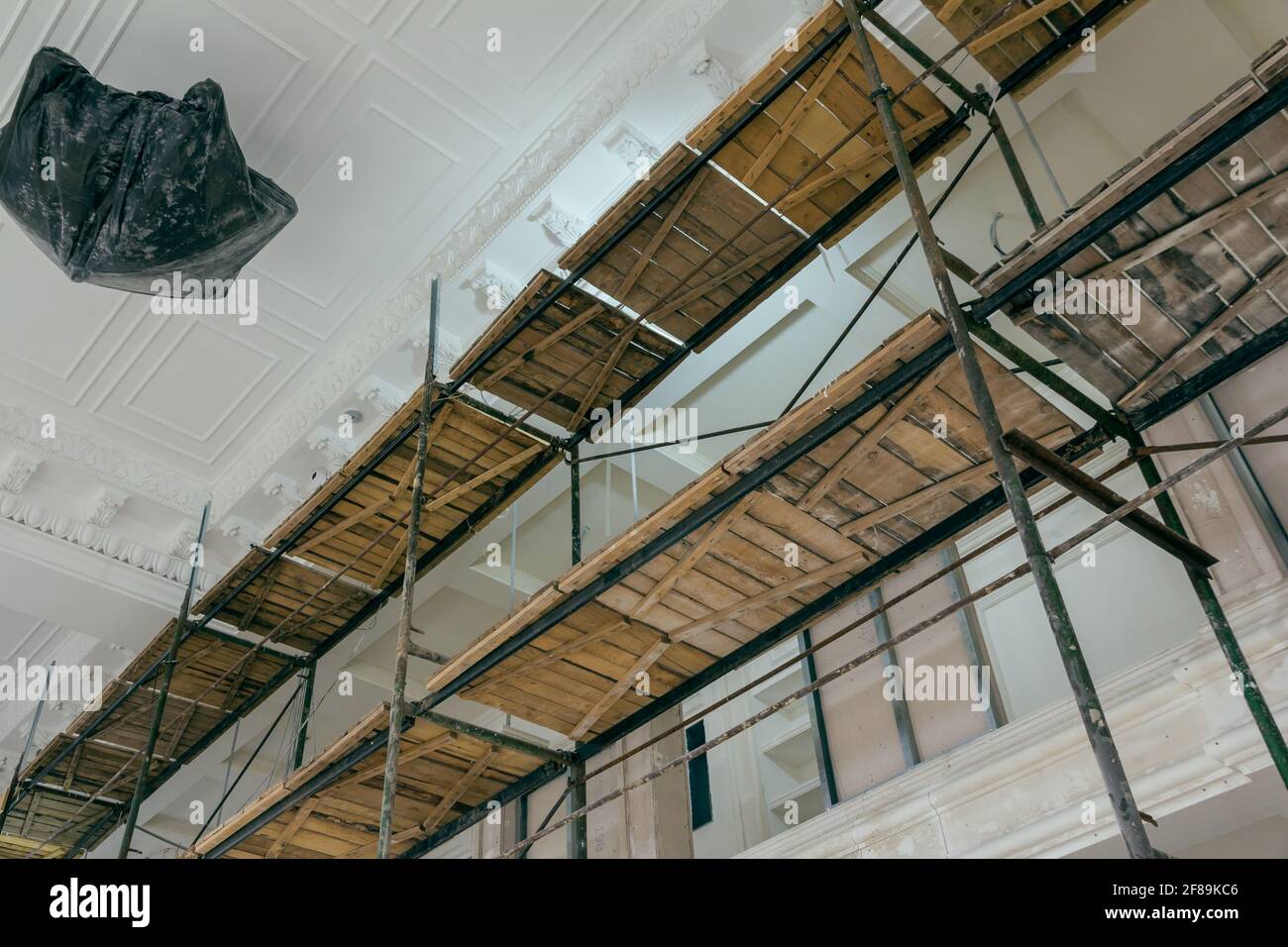 Reconstruction work. Repairing an old building. Building scaffolding ...