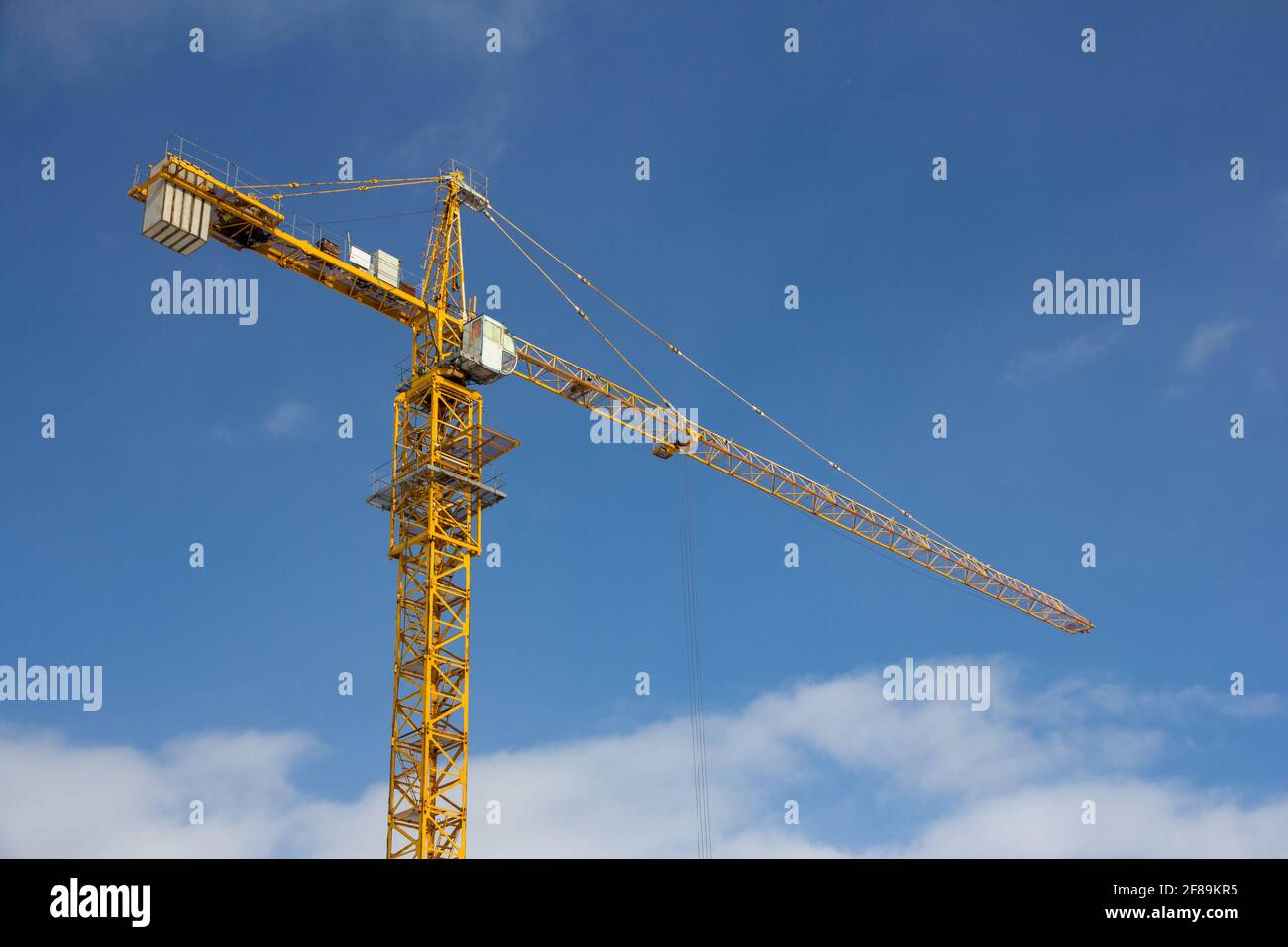Tower crane against the blue sky. Construction equipment Stock Photo ...