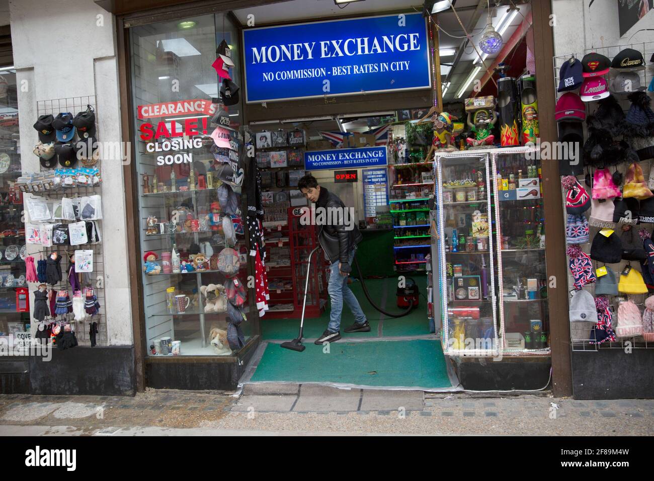 A gift shop worker cleans the shop during the reopening. Shops ...