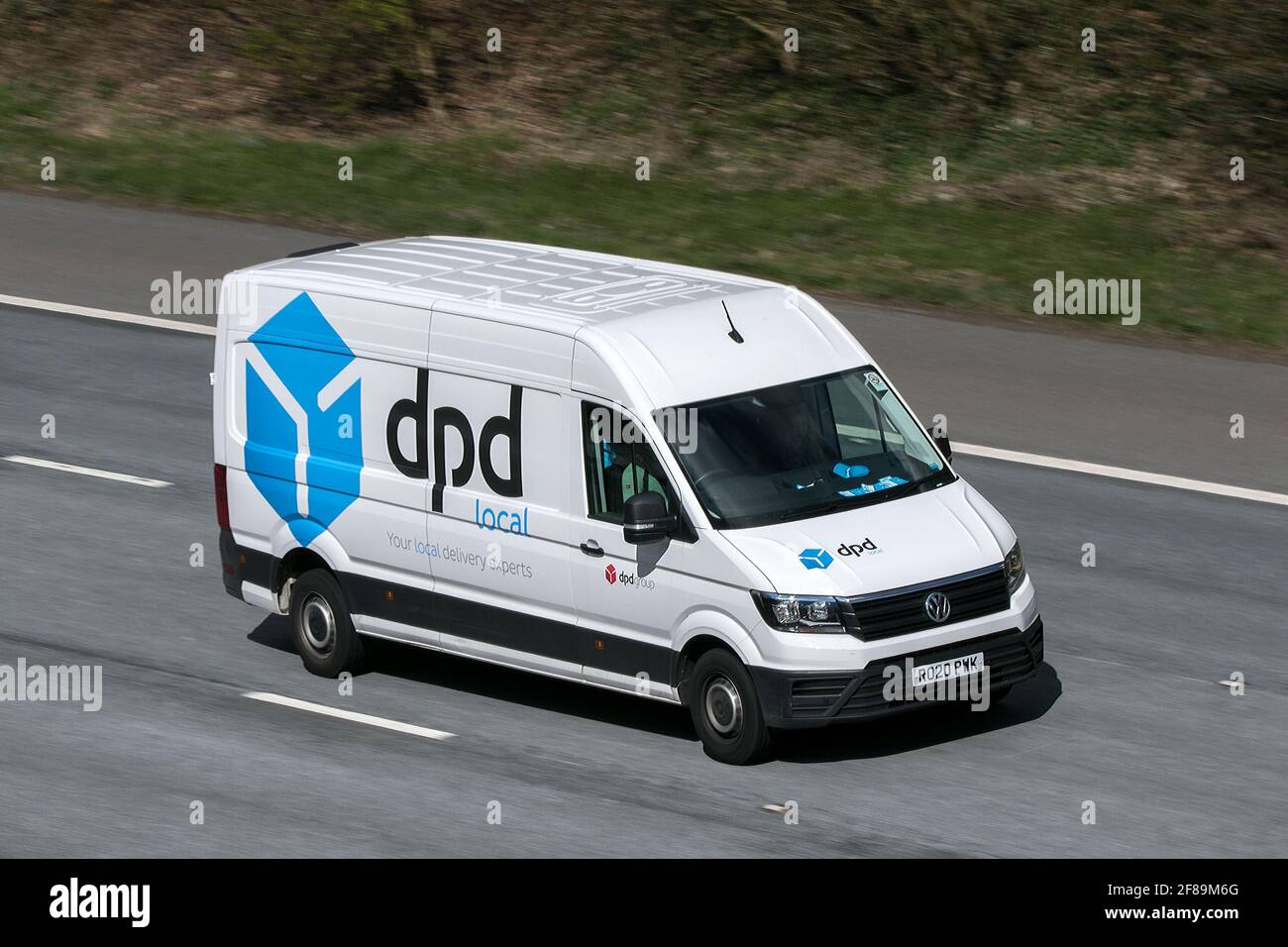 DPD parcels deliver van driving on the M6 motorway near Preston in ...