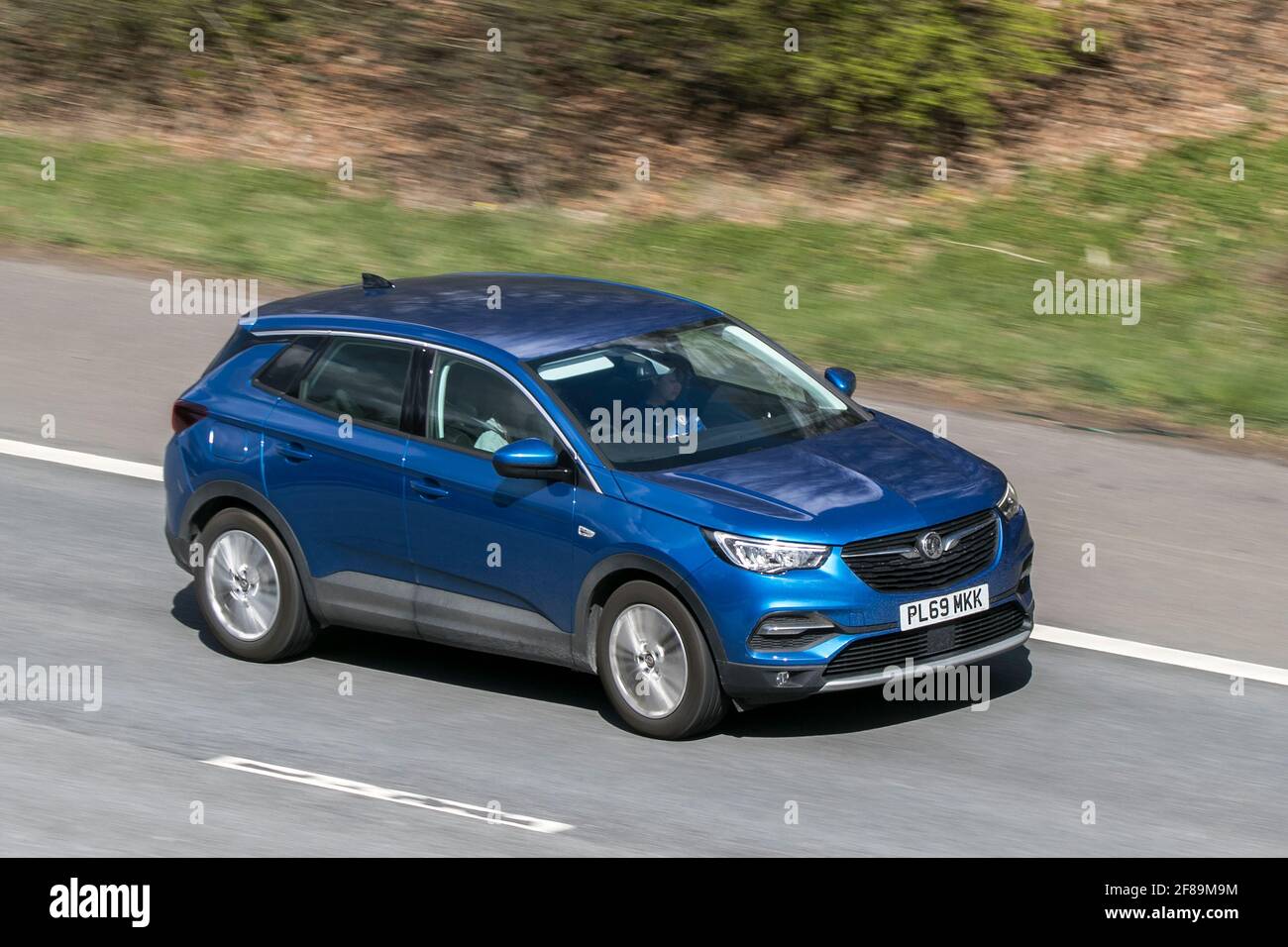 2020 blue Vauxhall Grandland X Business Ed Nav T; driving on the M6 ...