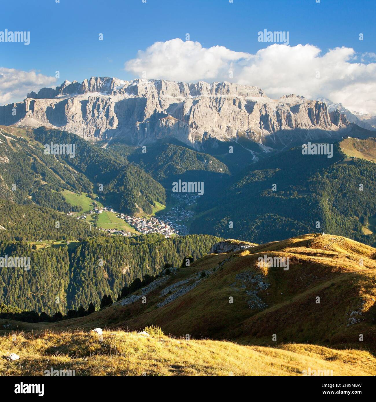 Evening view of Sella gruppe or gruppo di Sella with clouds and Selva ...
