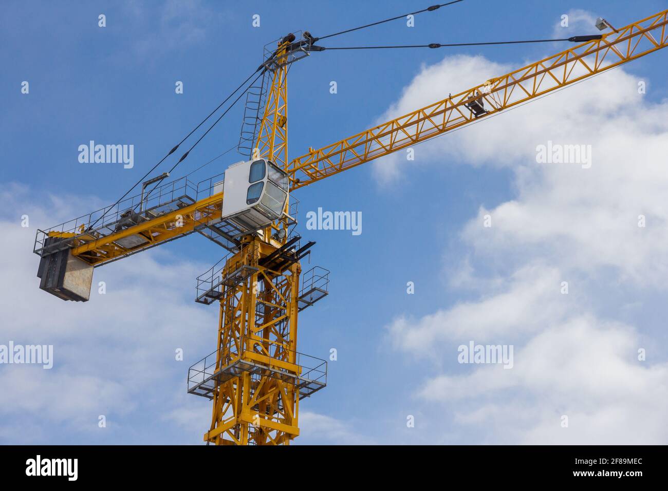 Tower crane against the blue sky. Construction equipment Stock Photo ...