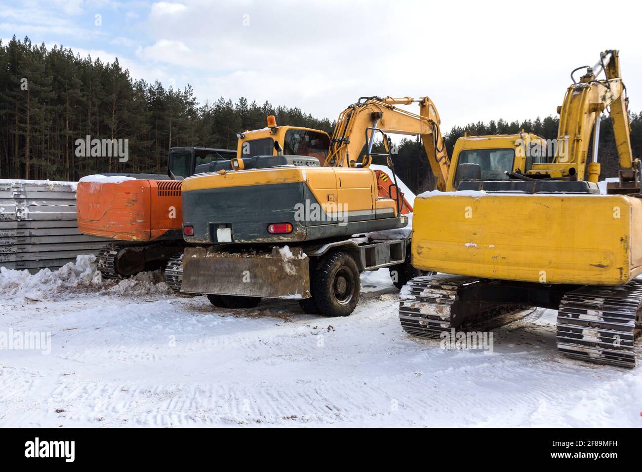 Excavators in the parking lot. Construction equipment in the parking ...