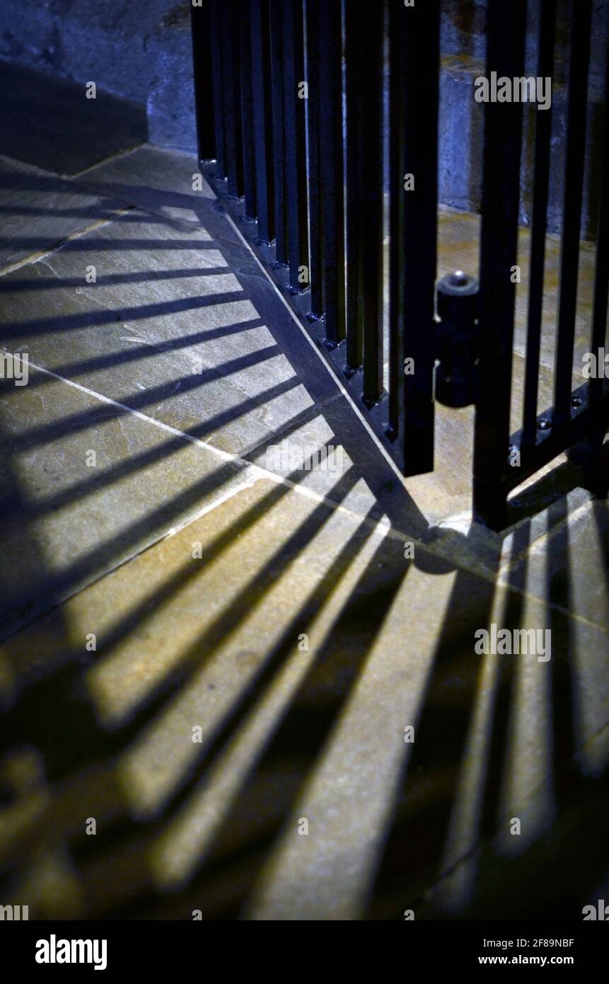 open iron prison gate Stock Photo - Alamy