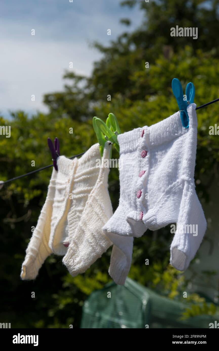 babies washing hanging on washing line Stock Photo - Alamy