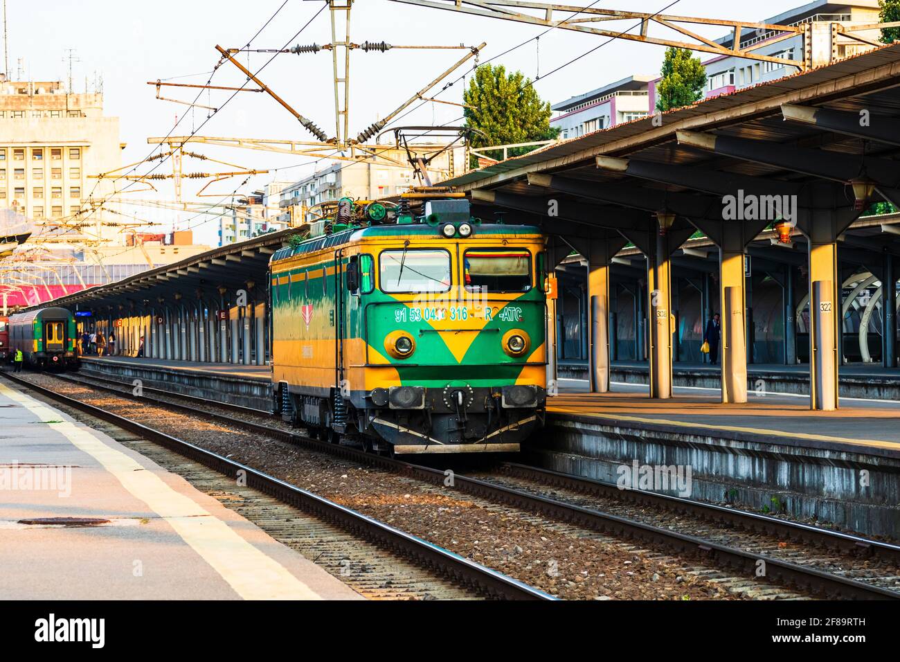 Detail of train in motion at train platform at Bucharest North Railway ...