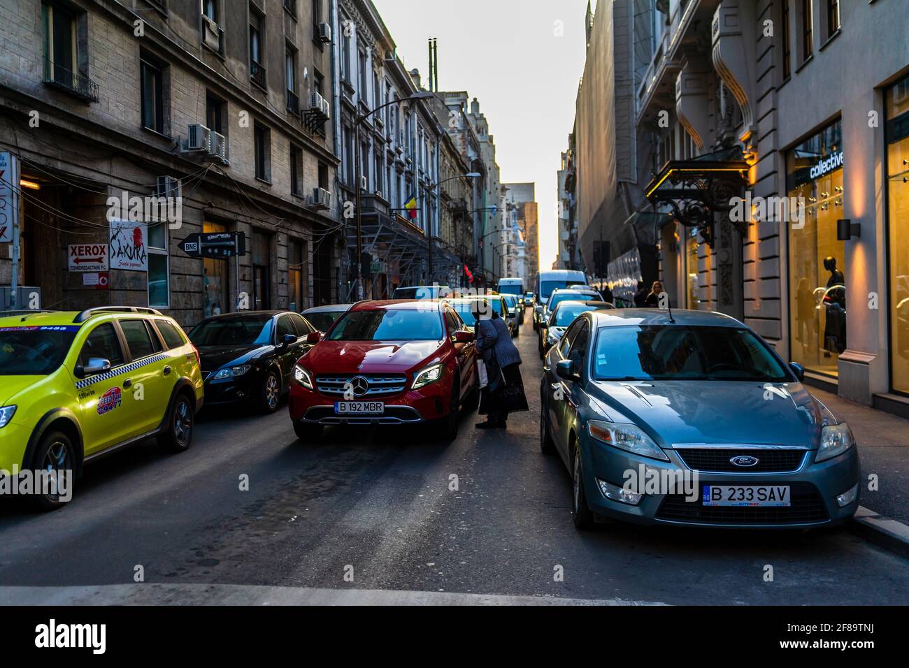 Car traffic at rush hour in downtown area of the city. Car pollution ...