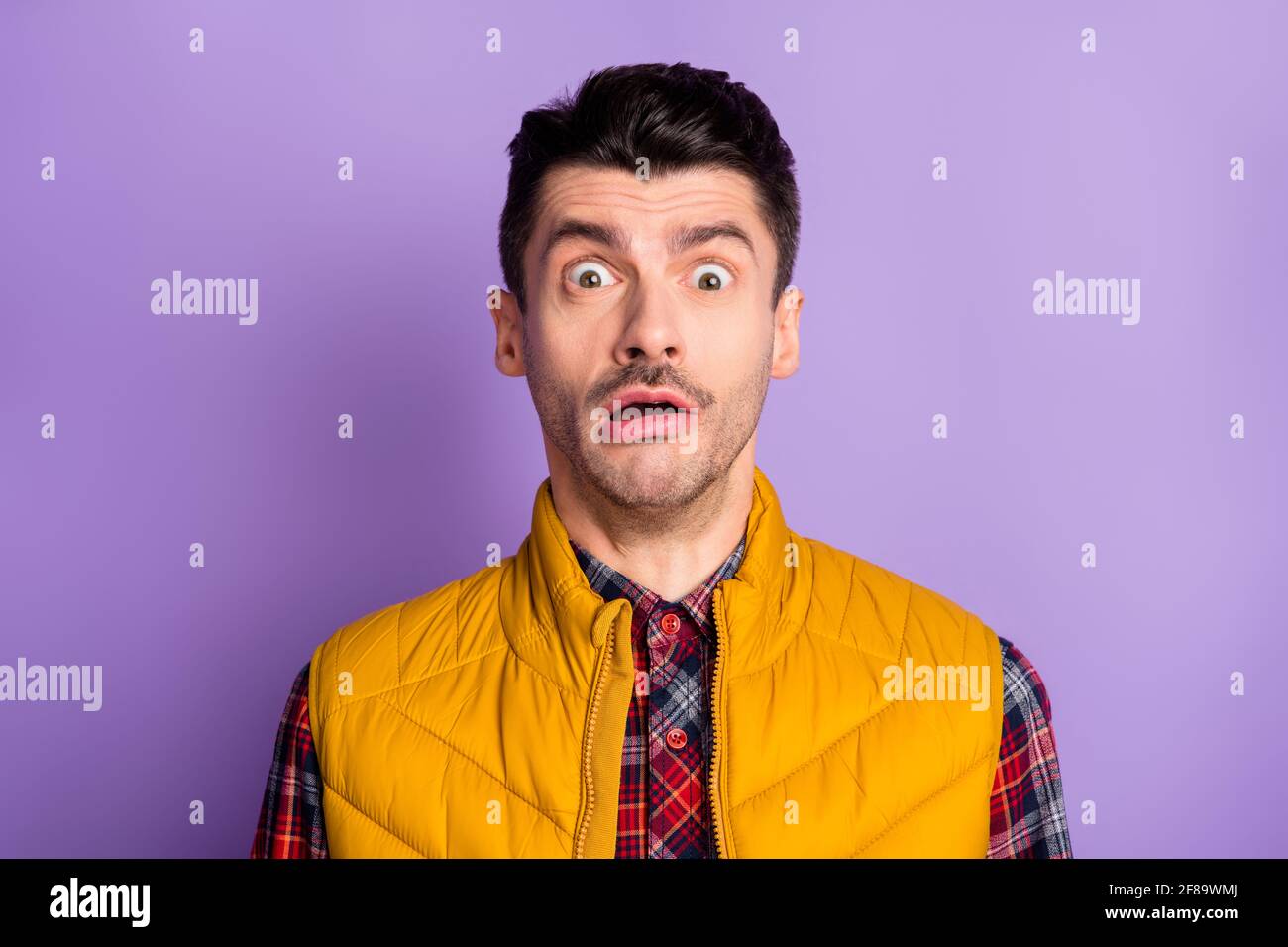 Photo of shocked upset guy dressed yellow vest big eyes open mouth big ...