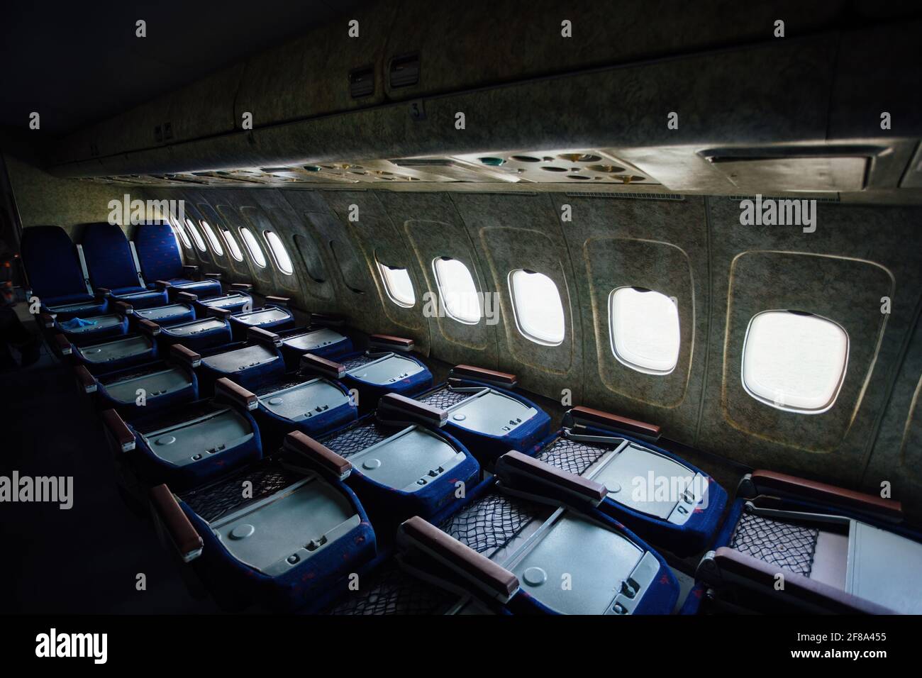 Inside of old abandoned passenger airplane. Plane wreck Stock Photo - Alamy