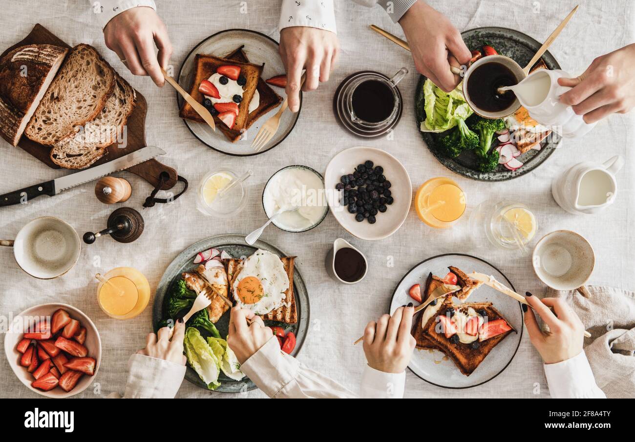 Group unrecognizable people breakfast hi-res stock photography and ...