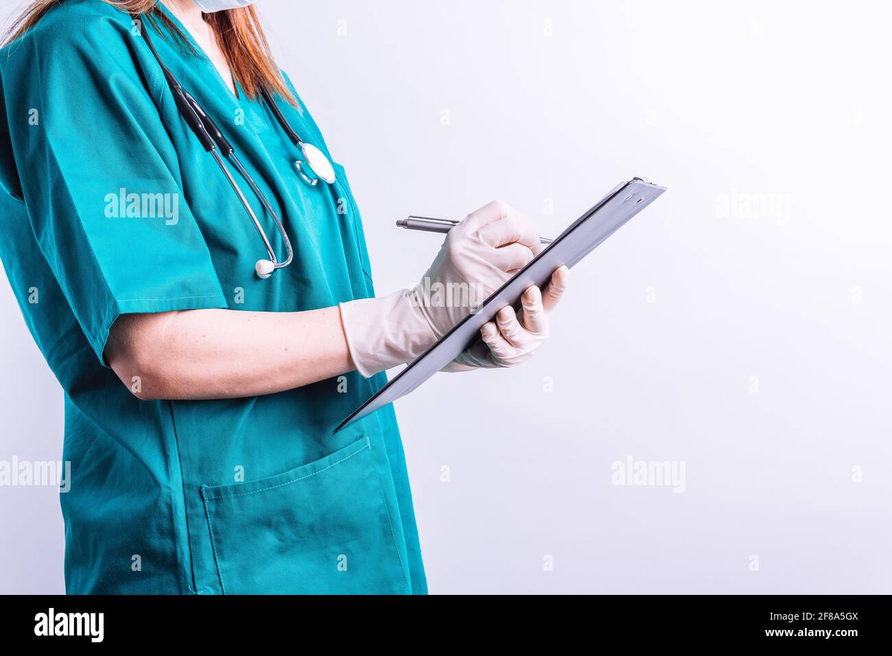 hand with stethoscope writes a report concept medical report Stock ...