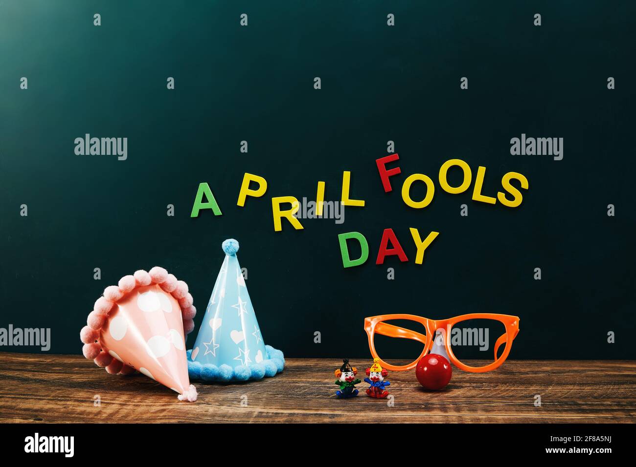 Party hats, clown glasses, and clown figurines with April Fools Day ...