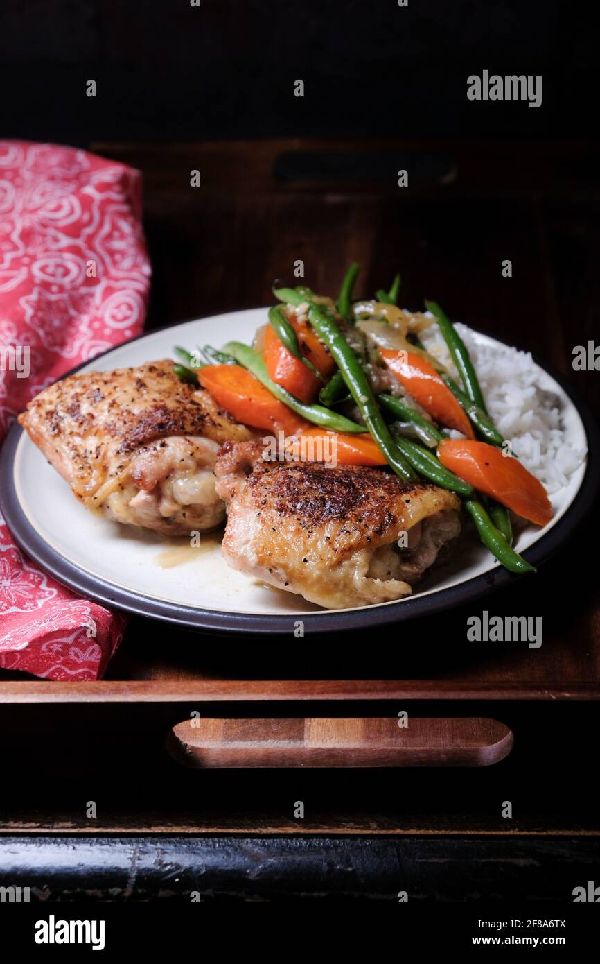 Vertical shot of chicken with rice and vegetables Stock Photo - Alamy