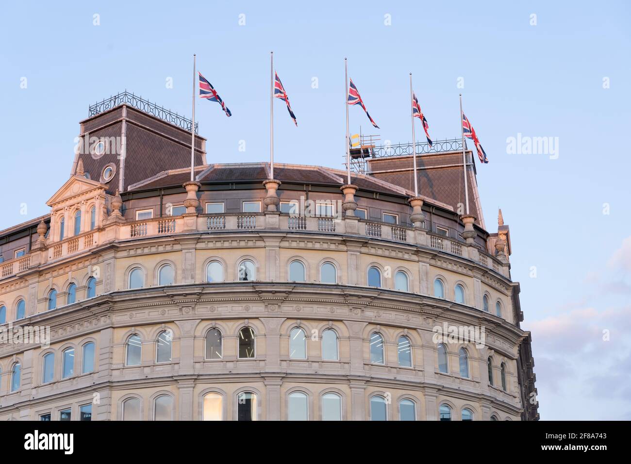 Union flags fly in half-mast on top of buildings around London ...