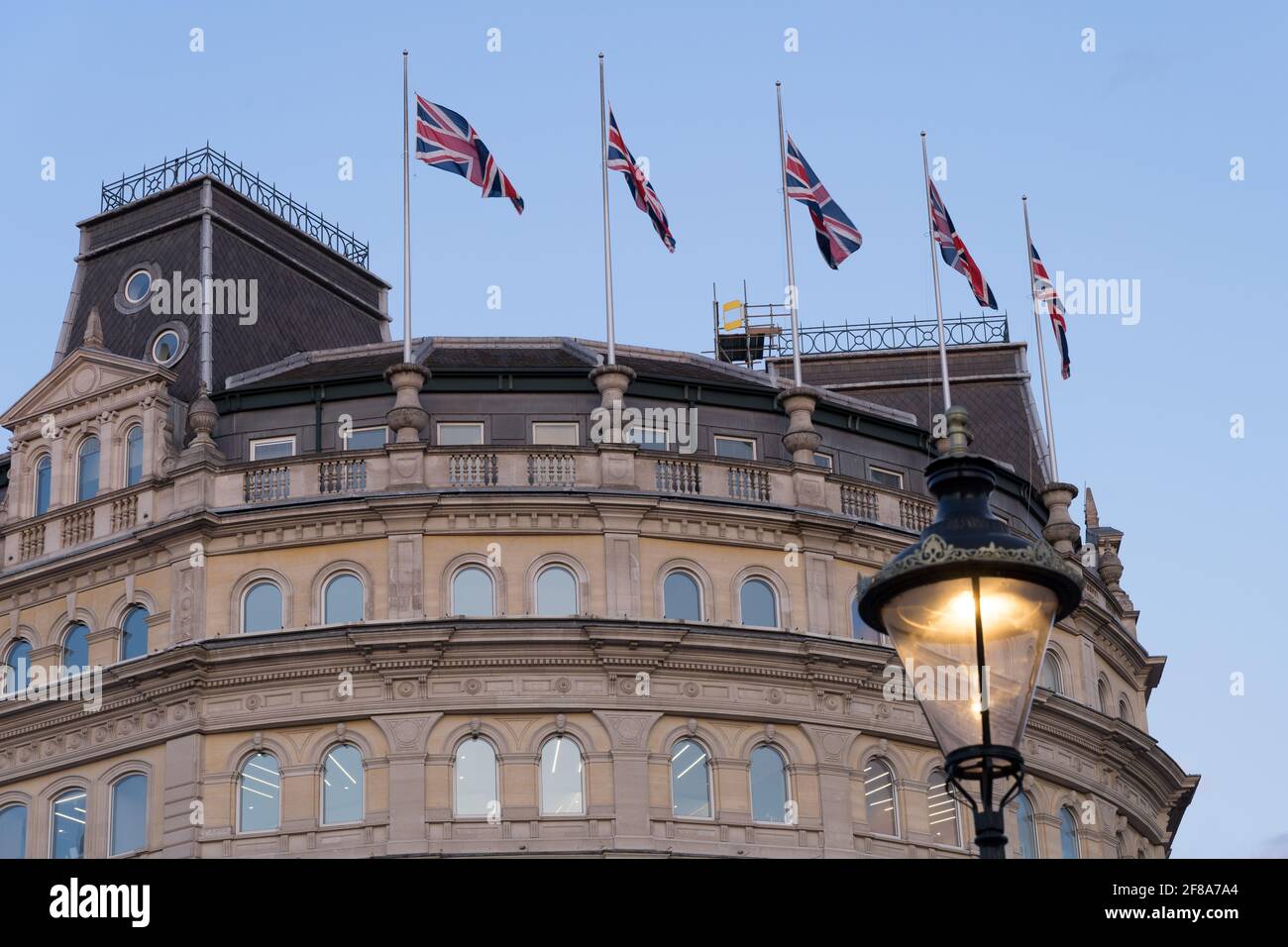 Union flags fly in half-mast on top of buildings around London ...