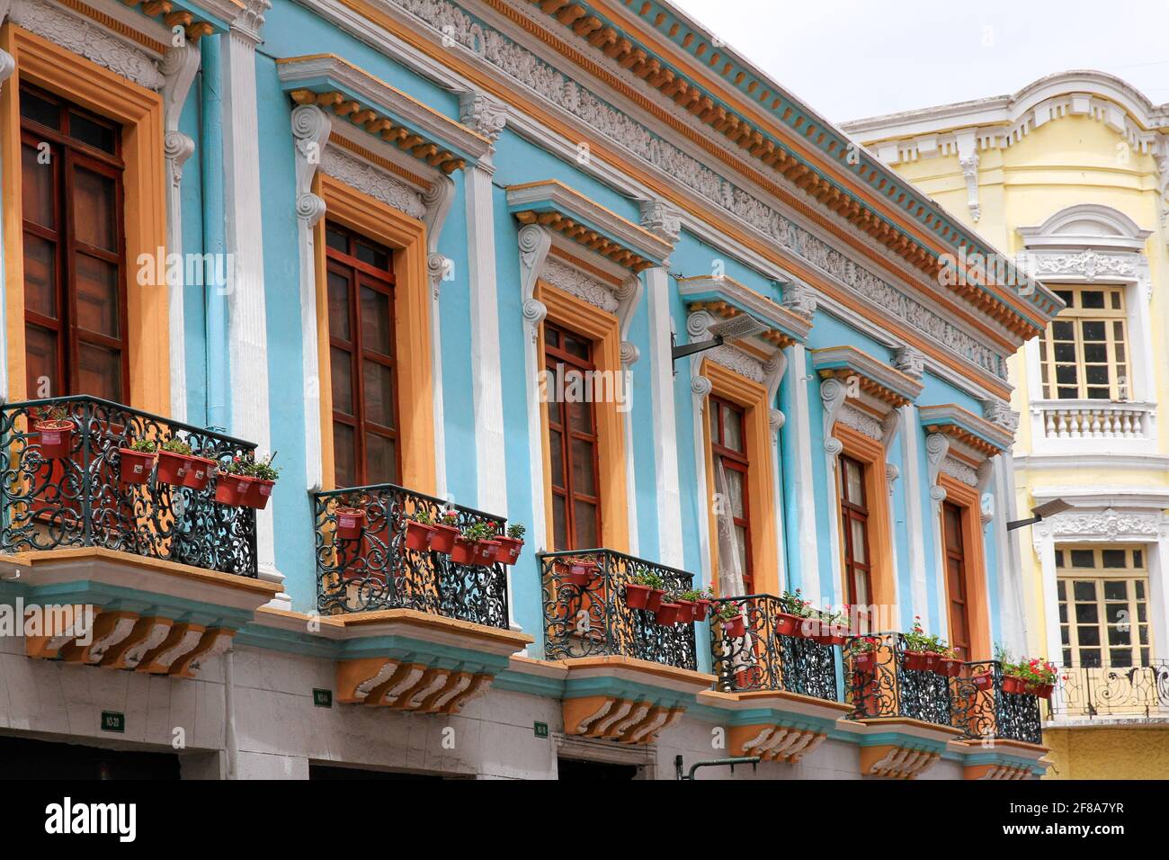 Wrought Iron Window Boxes along Colorful Buildings in Quito, Ecuador ...