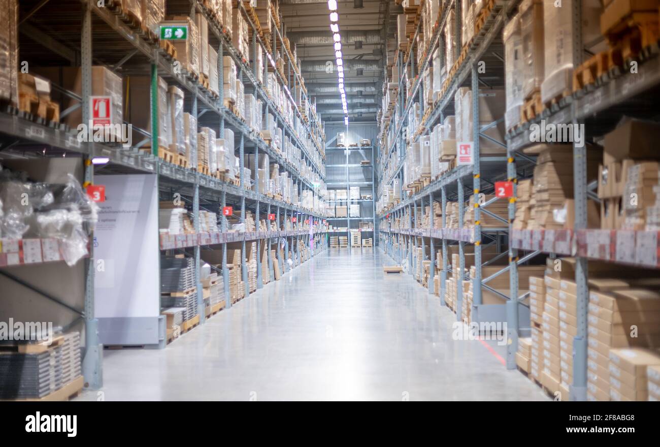The storage warehouse of the cardboard boxes put on the stainless steel ...