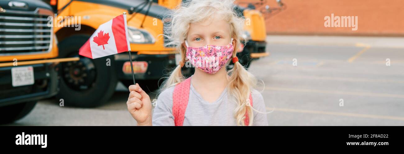 Young girl student in protective face mask with Canadian flag. Student ...
