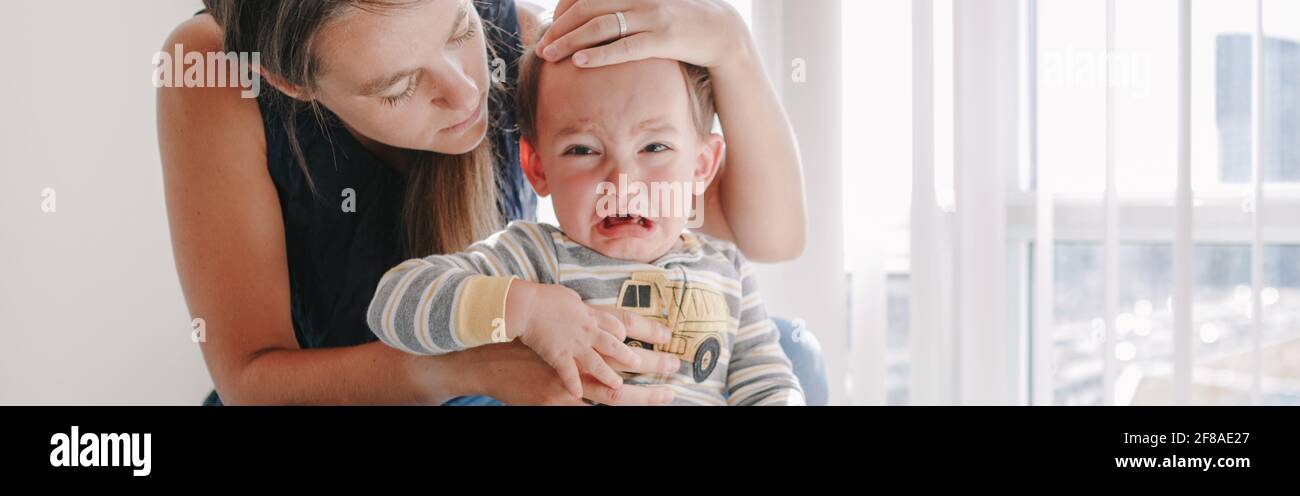 Hugging daughter crying boy hi-res stock photography and images - Alamy