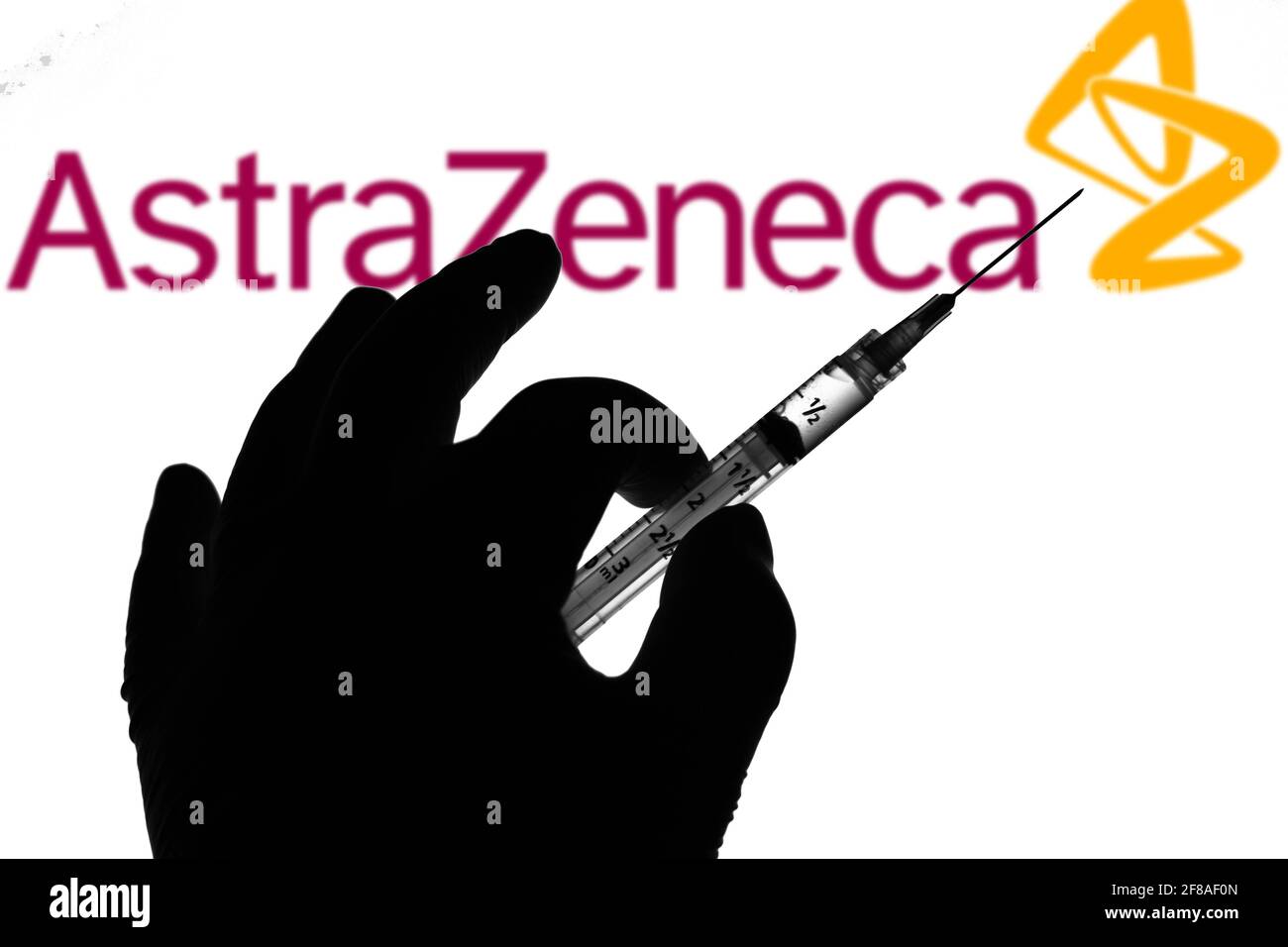 In this photo illustration the medical syringe is seen with AstraZeneca ...
