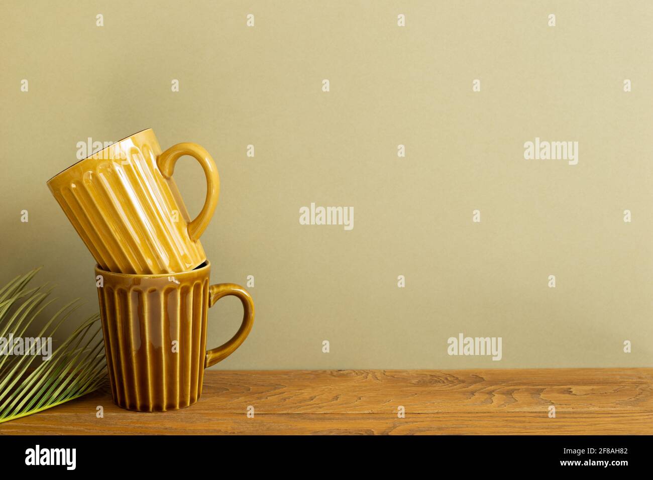 Stack of mug cup on wooden table. khaki beige background Stock Photo ...