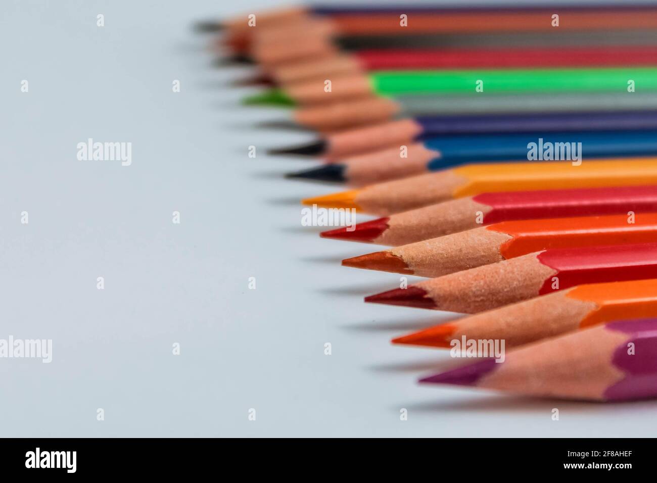Row of multicolored wooden pencil collection isolated on white ...