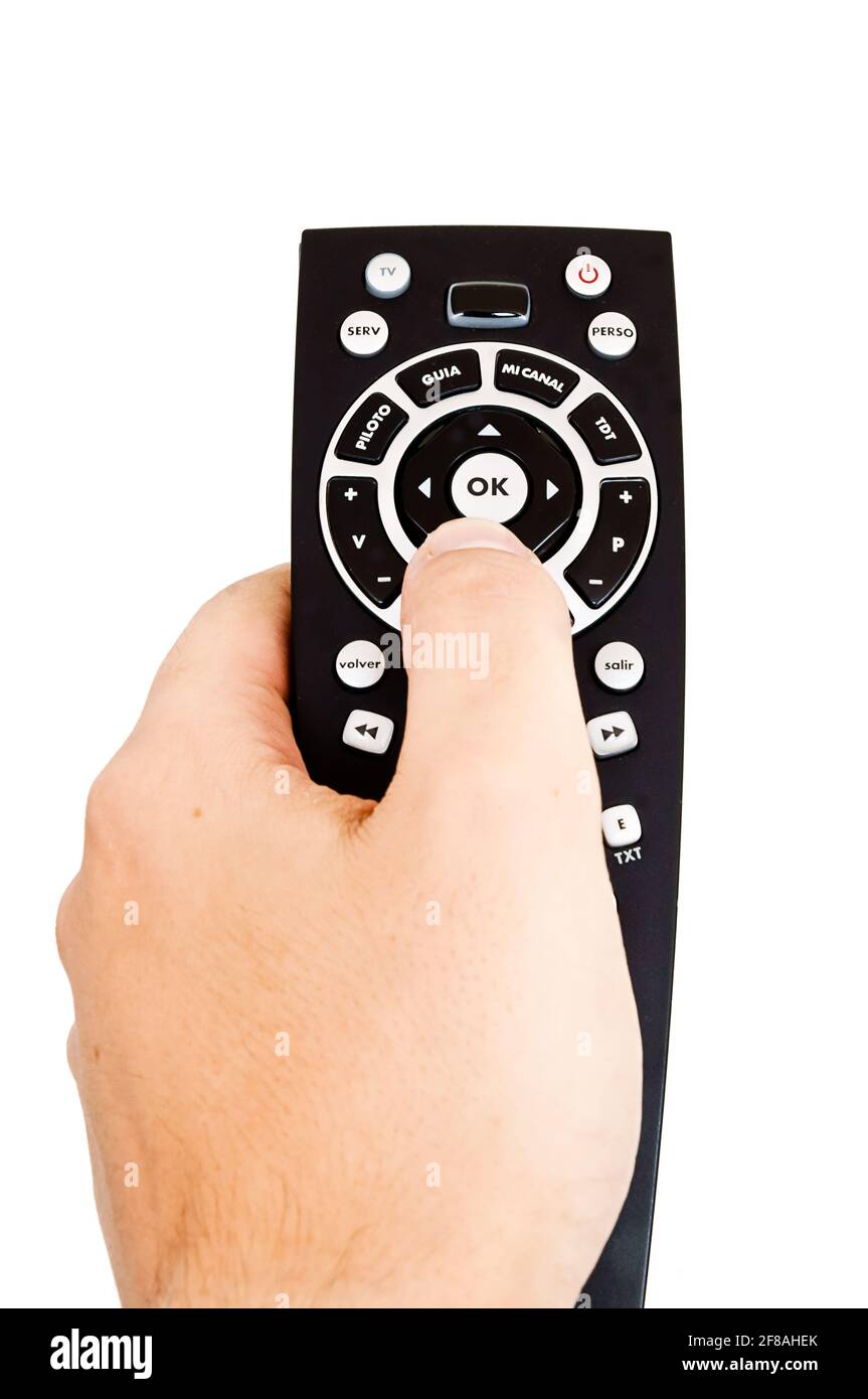 Man's hand holding a tv remote against the white background Stock Photo ...