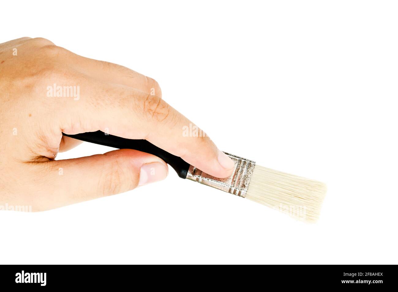 Man's hand holding a brush against the white background Stock Photo - Alamy