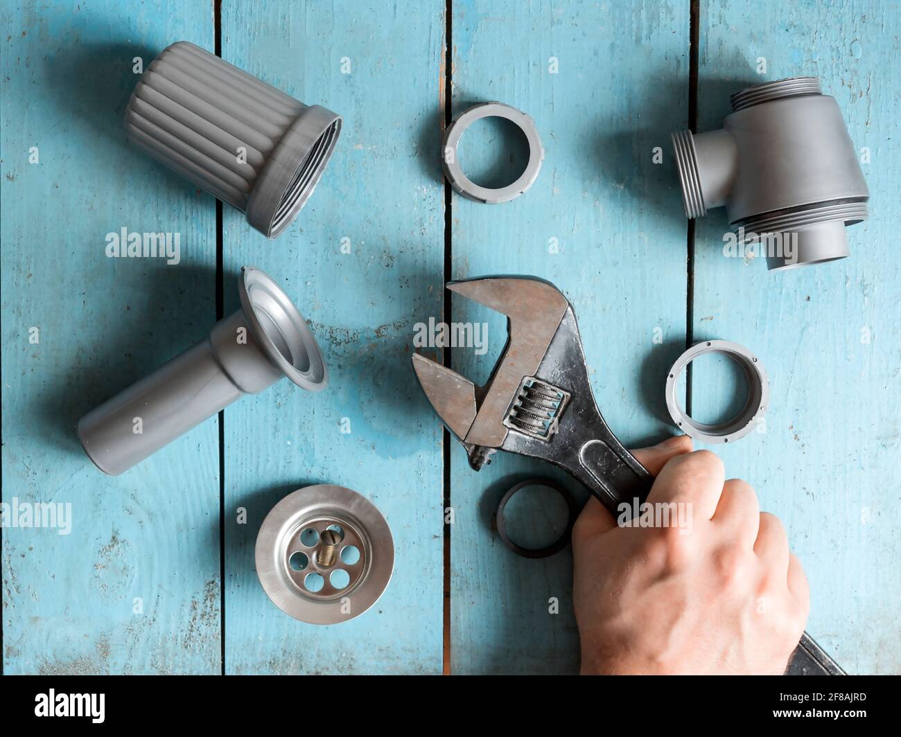 A set of tools and spare parts for plumbing. Adjustable wrench, faucet ...