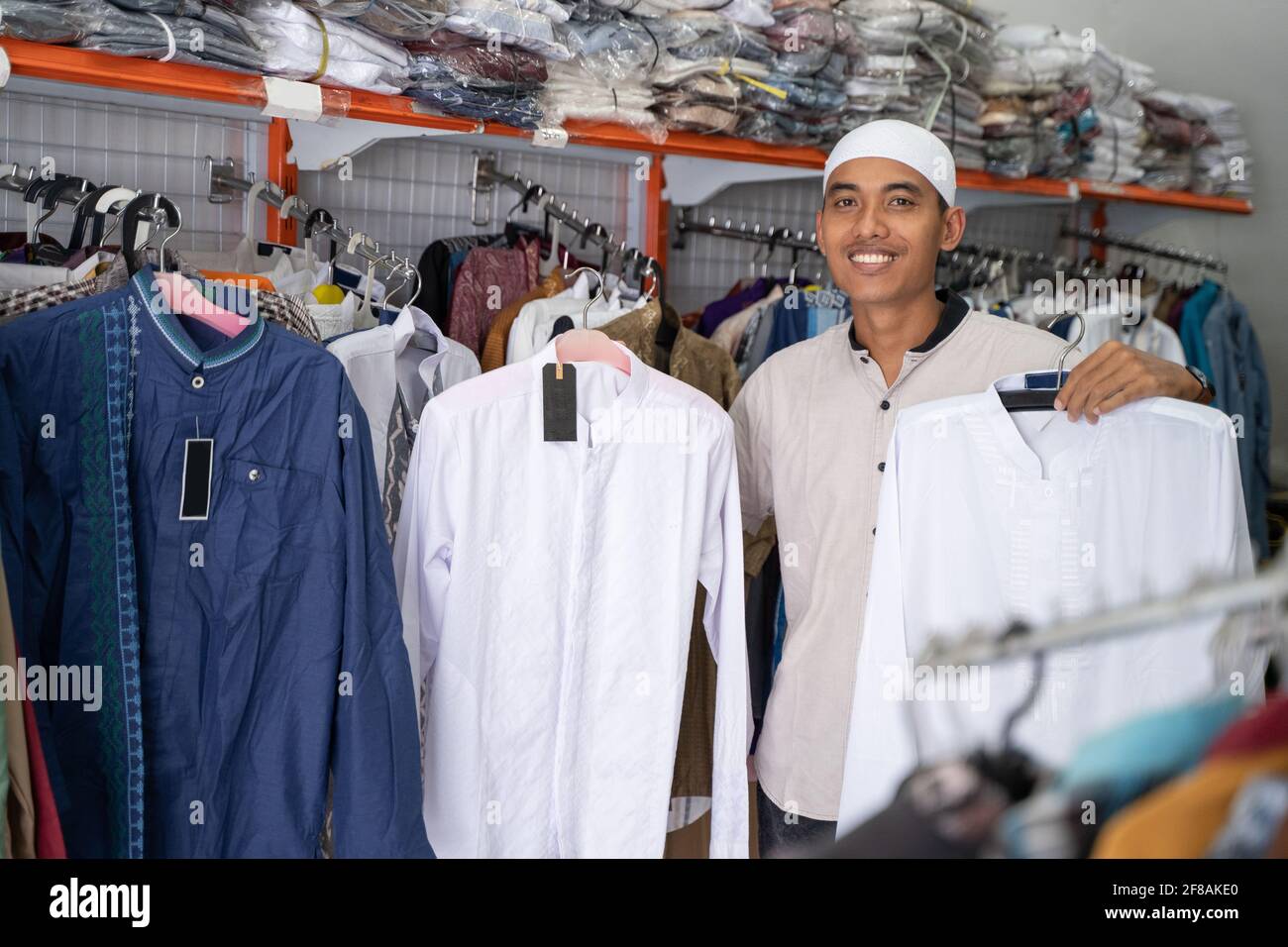 young asian muslim man shopping for clothes at store Stock Photo - Alamy