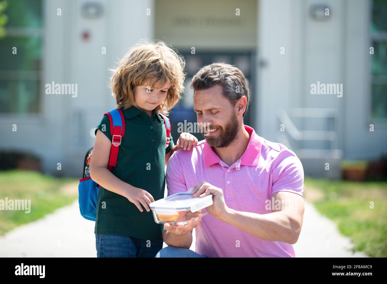 School boy going to school with father. Schoolboy and parent in shirt ...