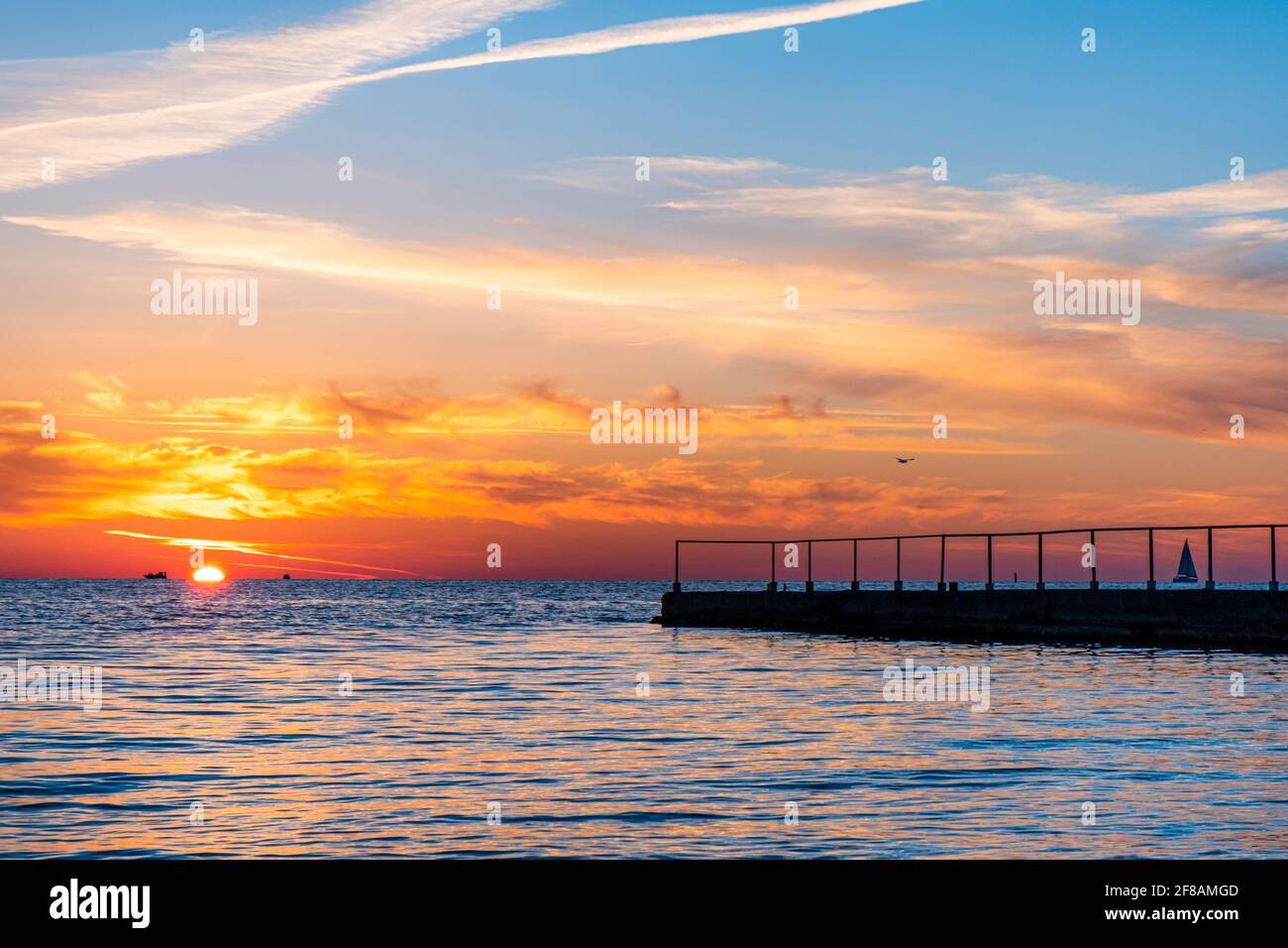 Sunrise sun reflecting on sea hi-res stock photography and images - Alamy